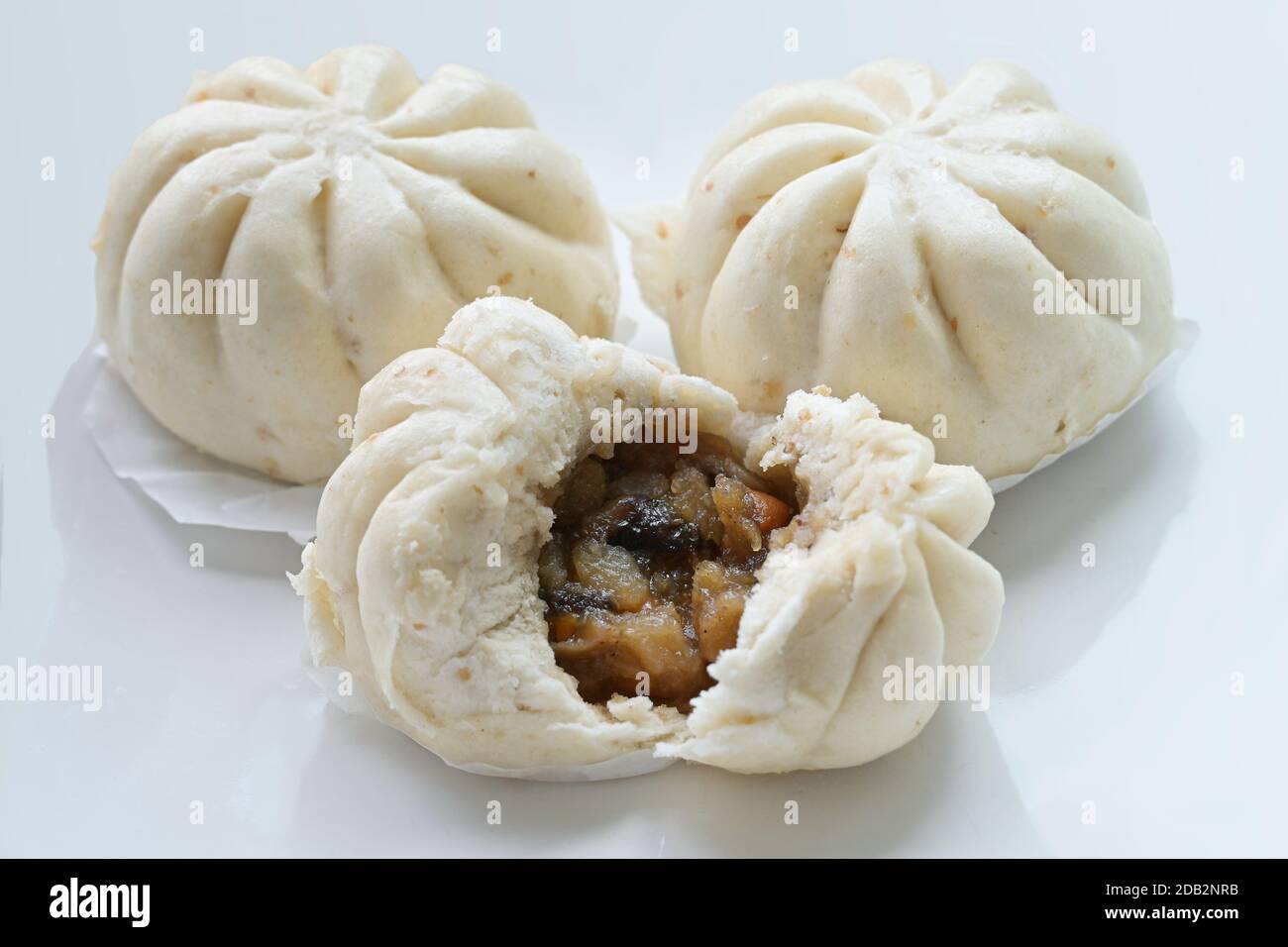Steamed Chinese vegetable buns, with mushroom and carrot stuffing Stock ...
