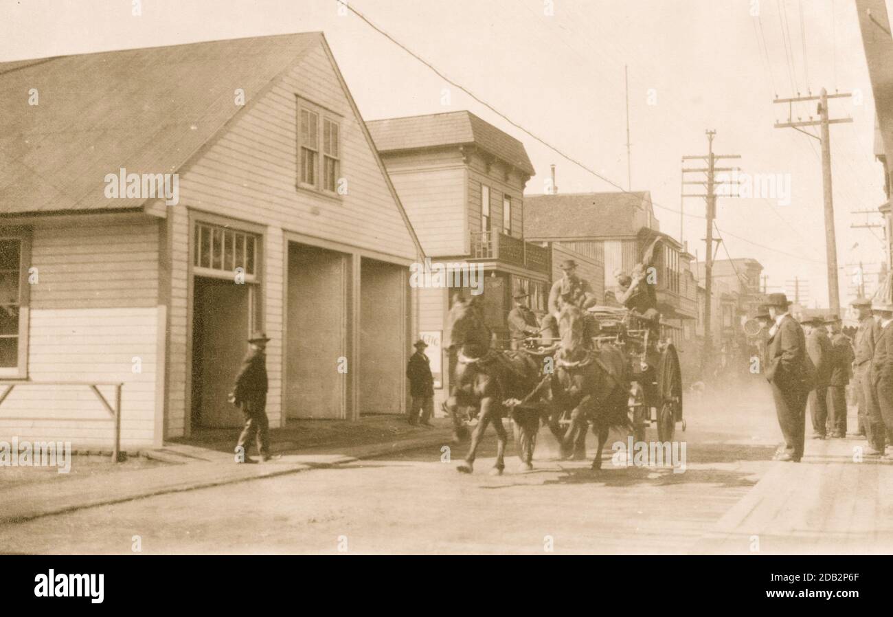 Firefighters practice racing to a fire with a team of horses pulling ...