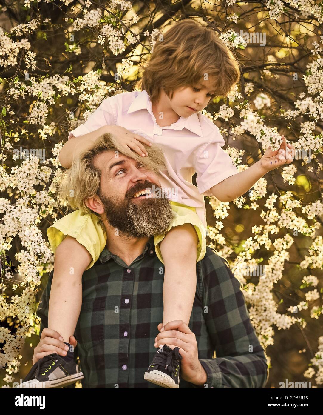 Little boy and father in nature background. Hipster and baby son ...