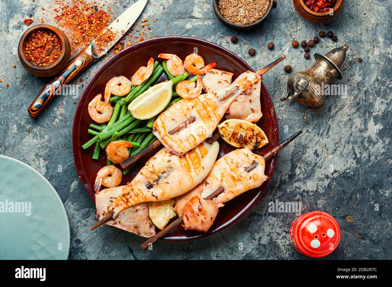 Grilled squid or calamari on skewer.Roasted whole squid Stock Photo - Alamy