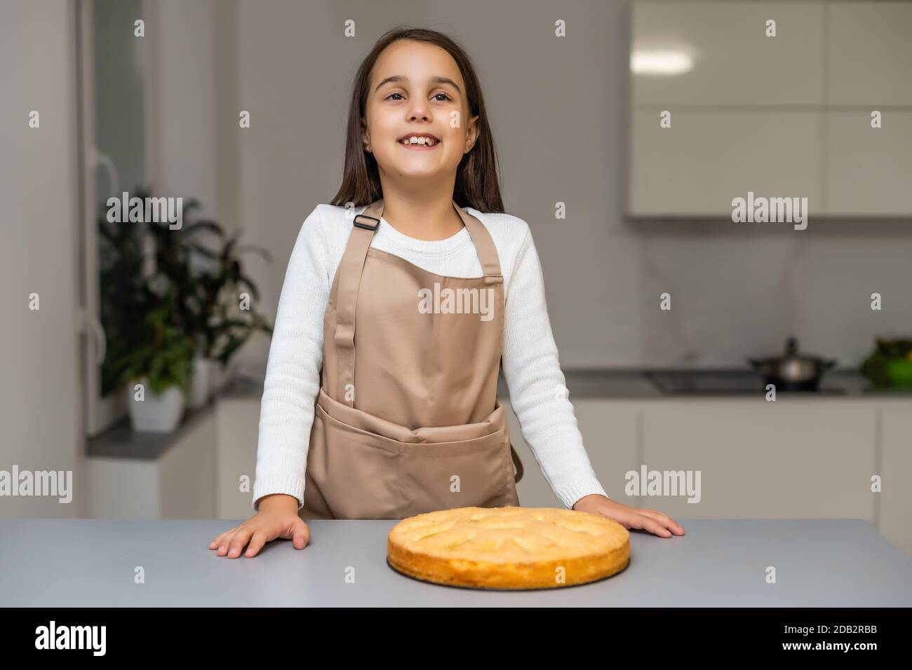 little girl showing apple pie that she baked Stock Photo - Alamy