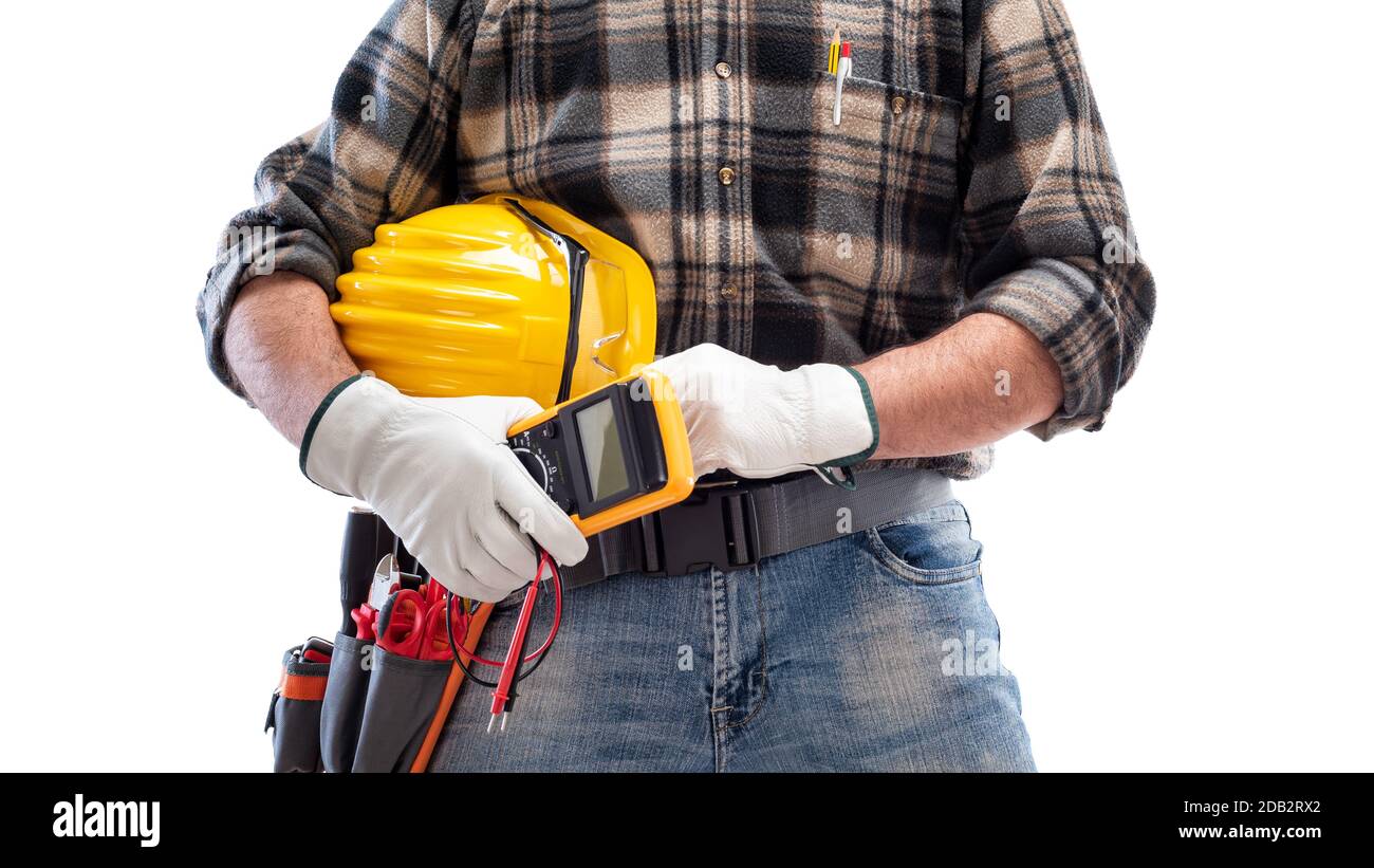Electrician holds multimeter tester in hand, helmet with protective ...