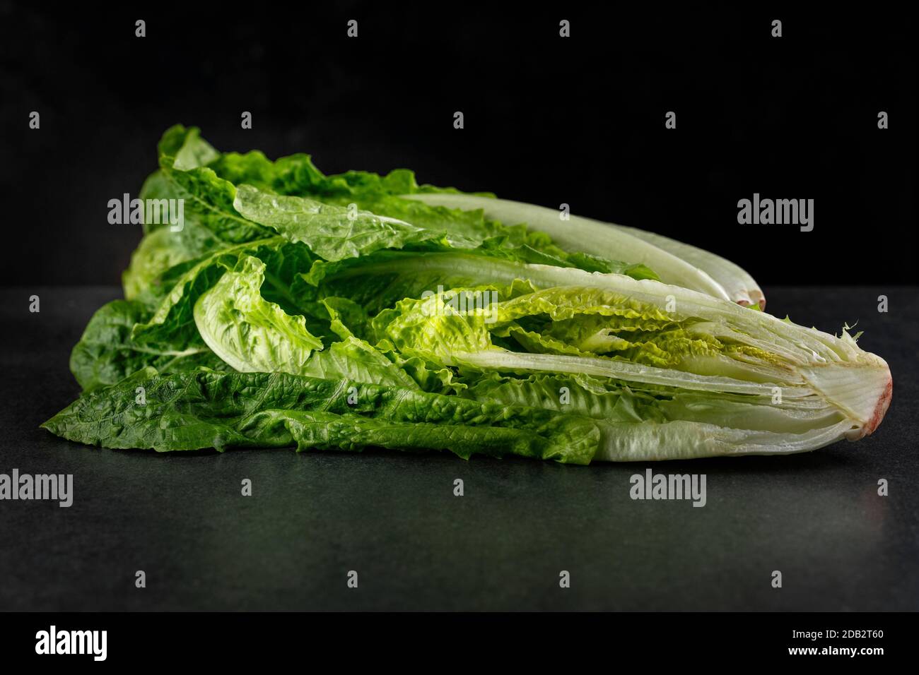 Lettuce Roman Lettuce on a dark background in a cut Stock Photo - Alamy