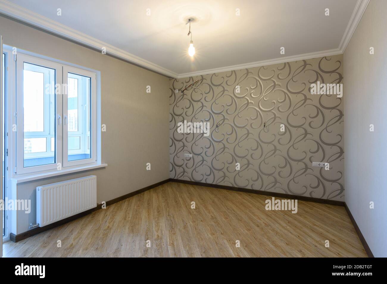 The interior of an empty, freshly renovated room in a new building ...
