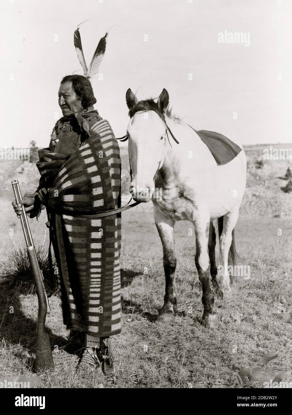 Sioux Indian, full-length portrait, facing left, holding rifle, in ...
