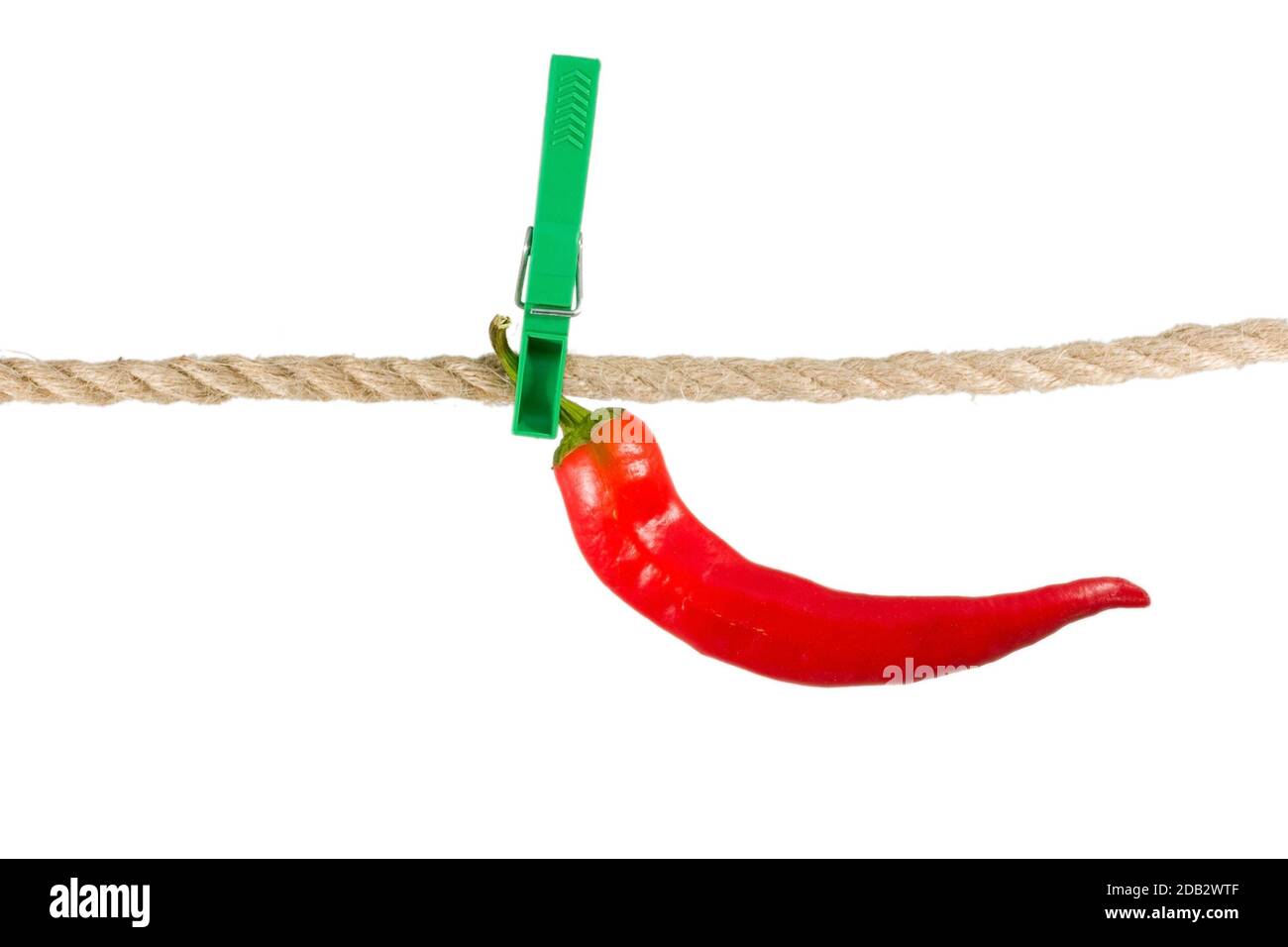 red pepper chile on clothes-peg rope isolated on white background Stock ...