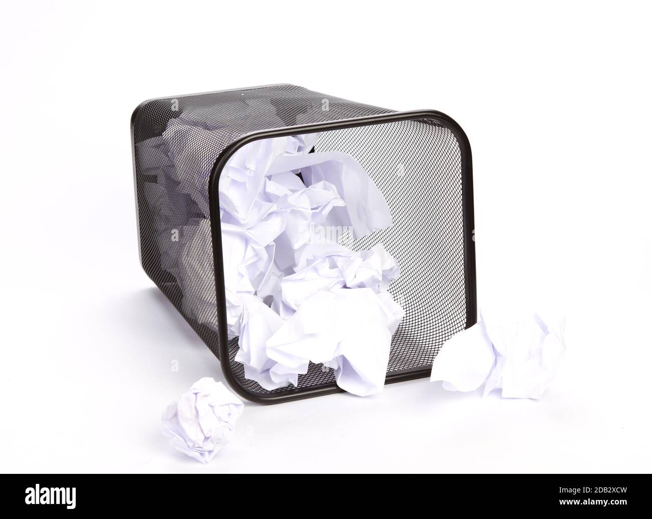 A trash bin full of crumpled paper on a white background Stock Photo ...