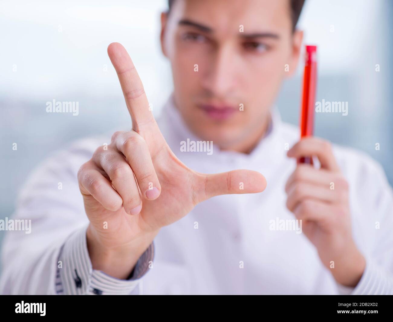 The man doctor checking blood samples in lab Stock Photo - Alamy