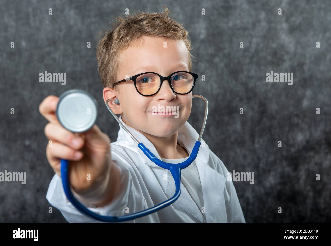 Cute kid boy wear medical uniform playing doctor, a portrait Stock ...
