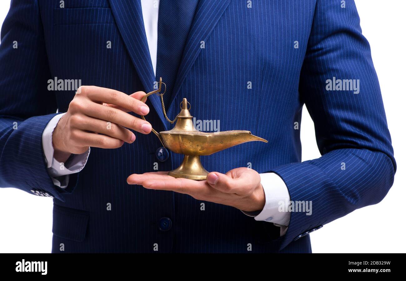 The businessman with magic lamp isolated on white Stock Photo - Alamy
