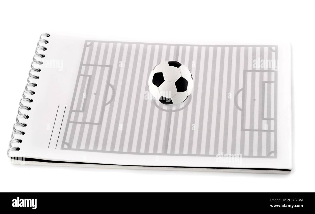 soccer field with ball in spiral note pad , isolated on white ...