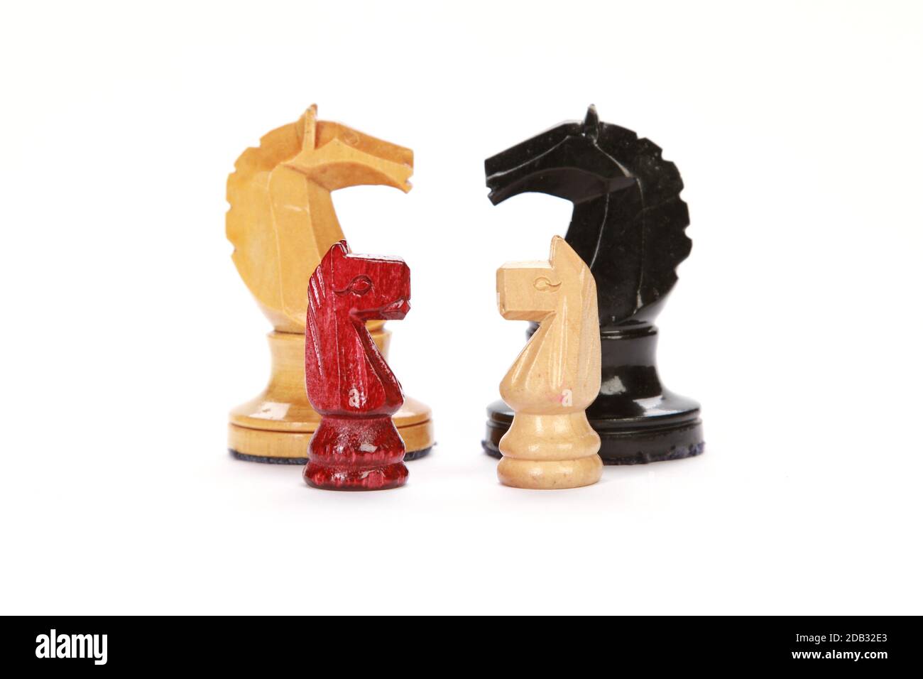 Four knight chess figures isolated on white background Stock Photo - Alamy