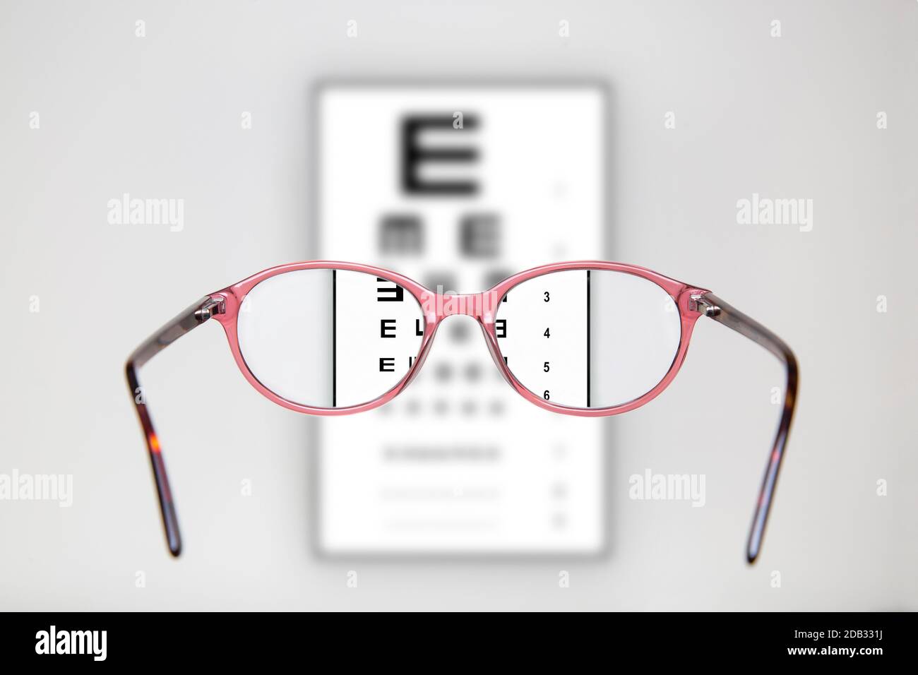 Exam view with optometric table and red glasses Stock Photo - Alamy