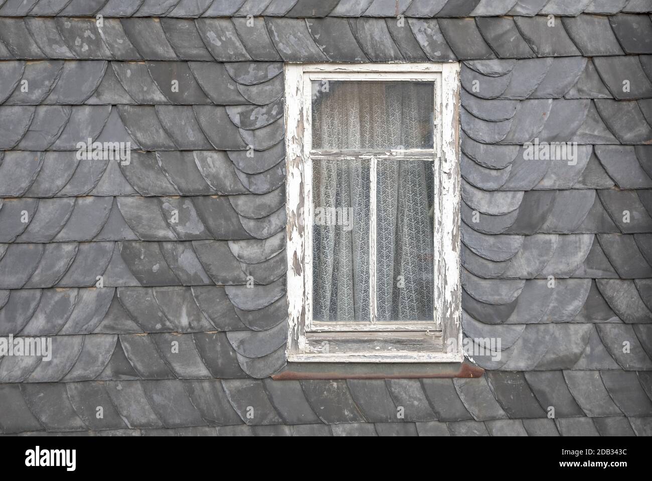 Slate tiles with old window on a facade of a typical home in Thuringia ...