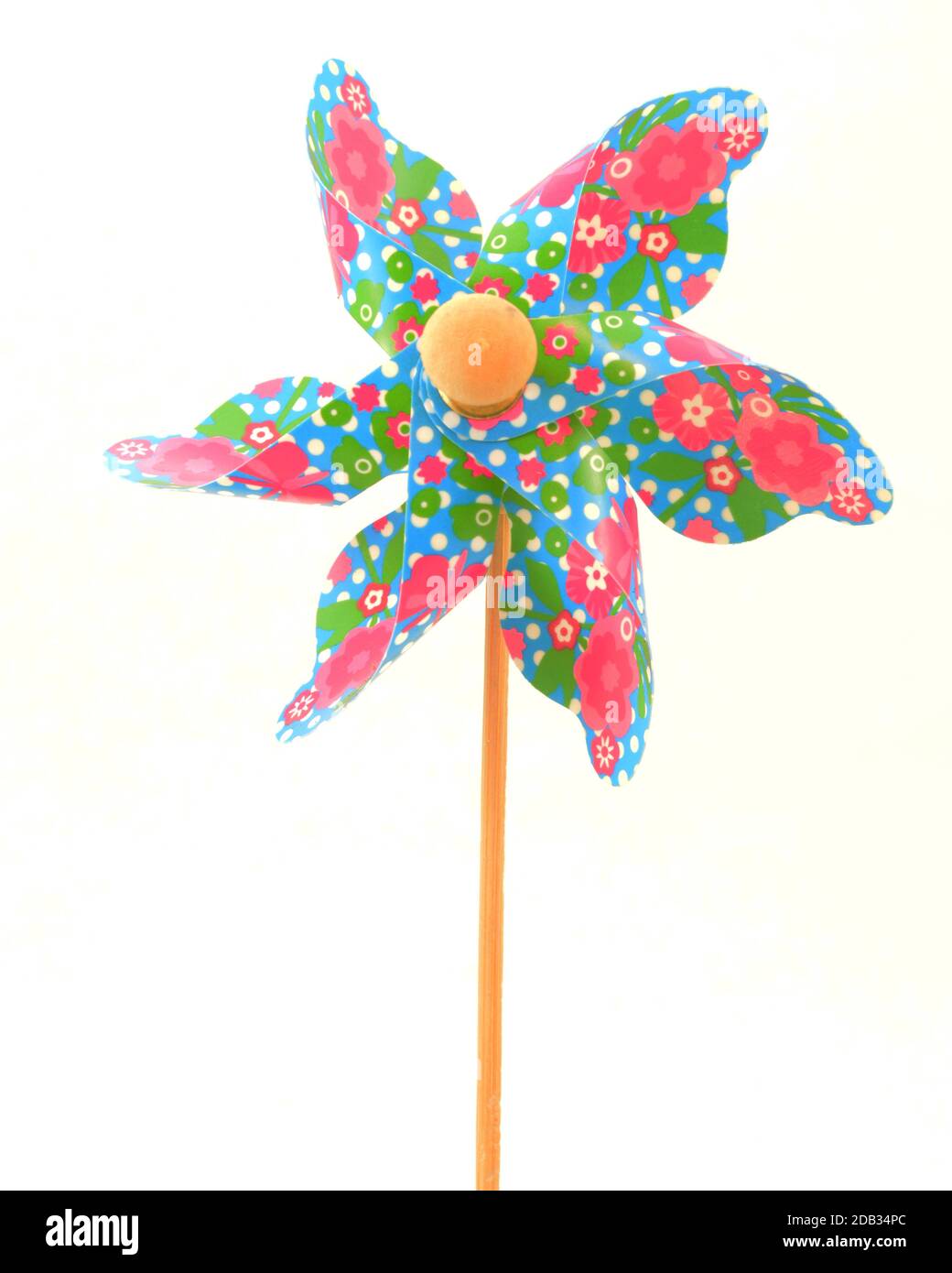 A closeup view of a colorful pin wheel over a white background Stock ...