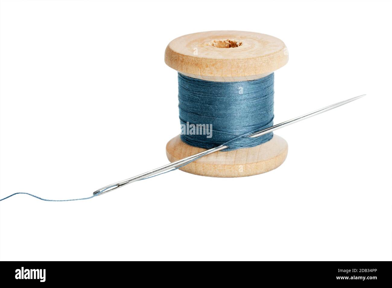 Spool of thread with needle isolated on white background Stock Photo ...