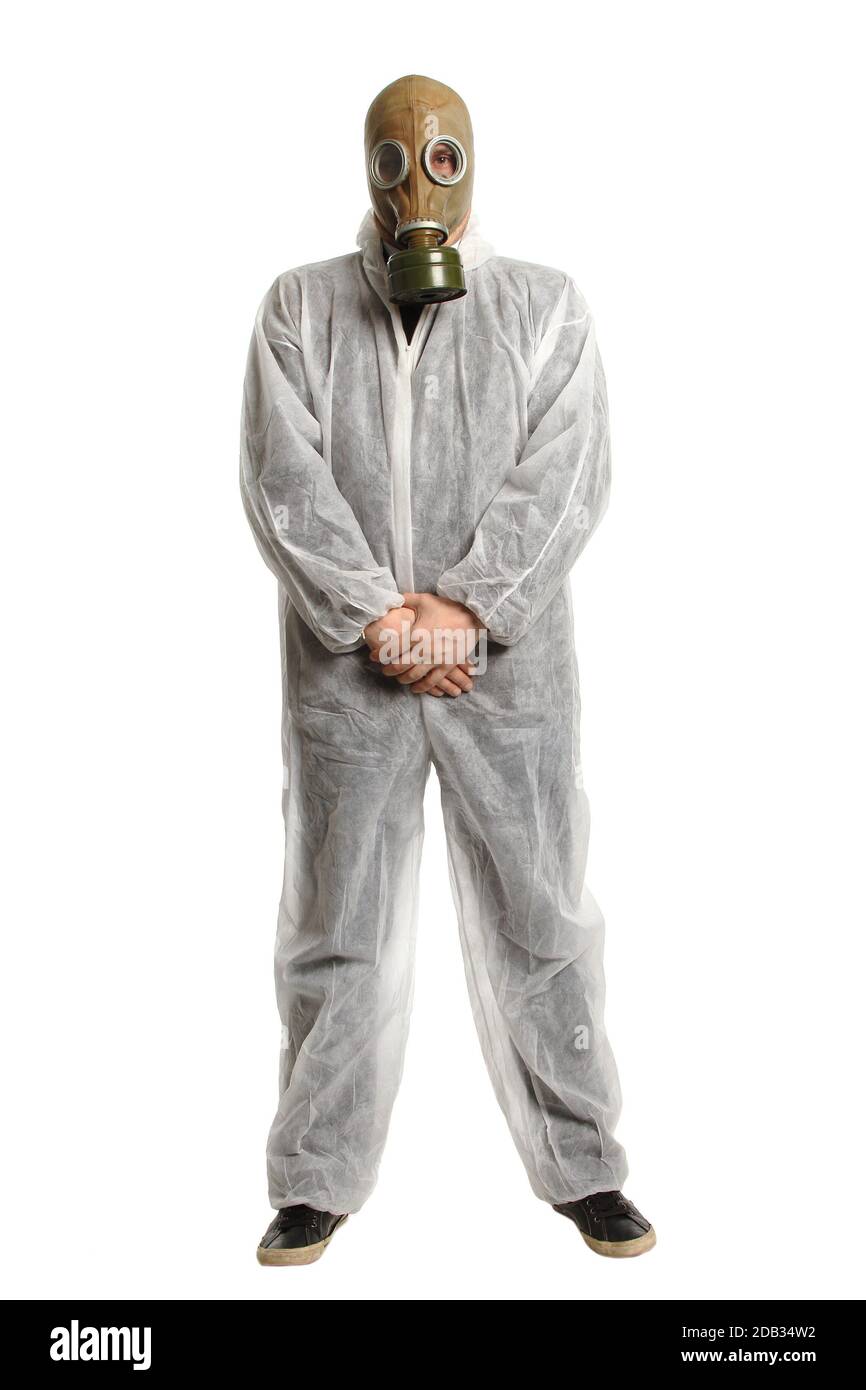 A vertical shot of a male in full protective clothing wearing a gas ...