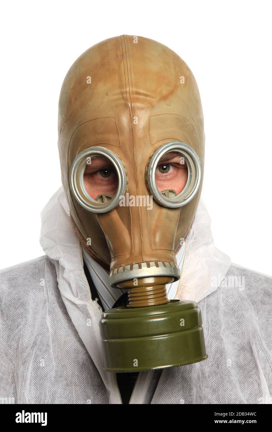 A vertical shot of a male wearing a protective suit and a gas mask ...