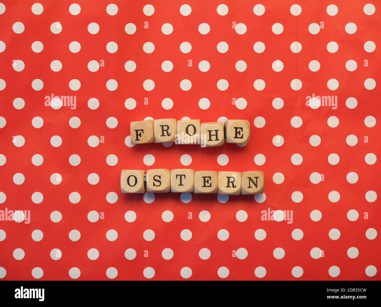 German words Happy Easter on dotted background, red background with ...