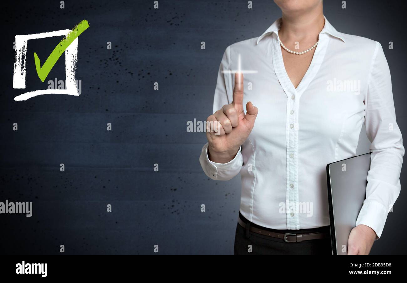 Checkbox touchscreen is shown by businesswoman Stock Photo - Alamy
