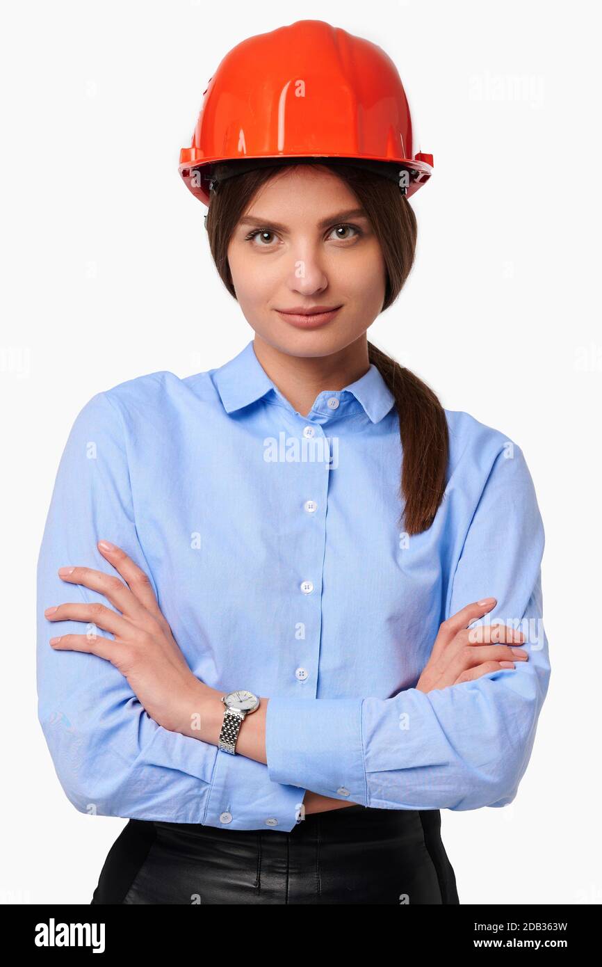 Crossed arms caucasian female engineer in helmet on white isolated ...