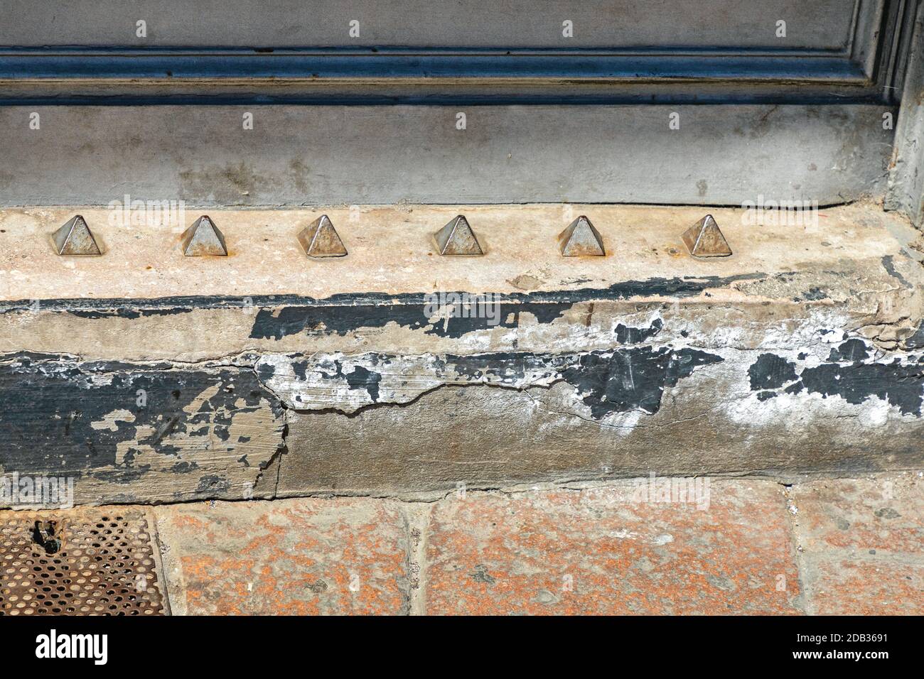 Metal Spikes Anti Homeless Device in Front of Building Stock Photo - Alamy