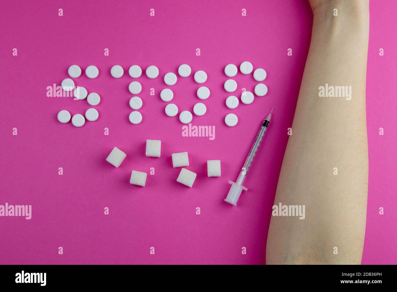 The word stop is made of tablets, next to the outline of the hand ...