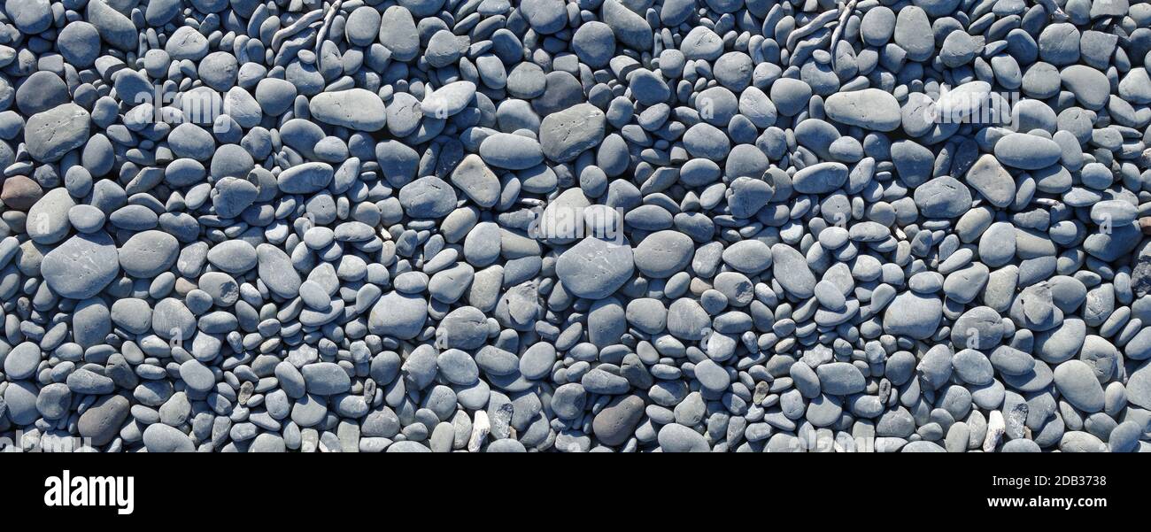 pebbles on a beach background texture. Banner wallpaper Stock Photo - Alamy