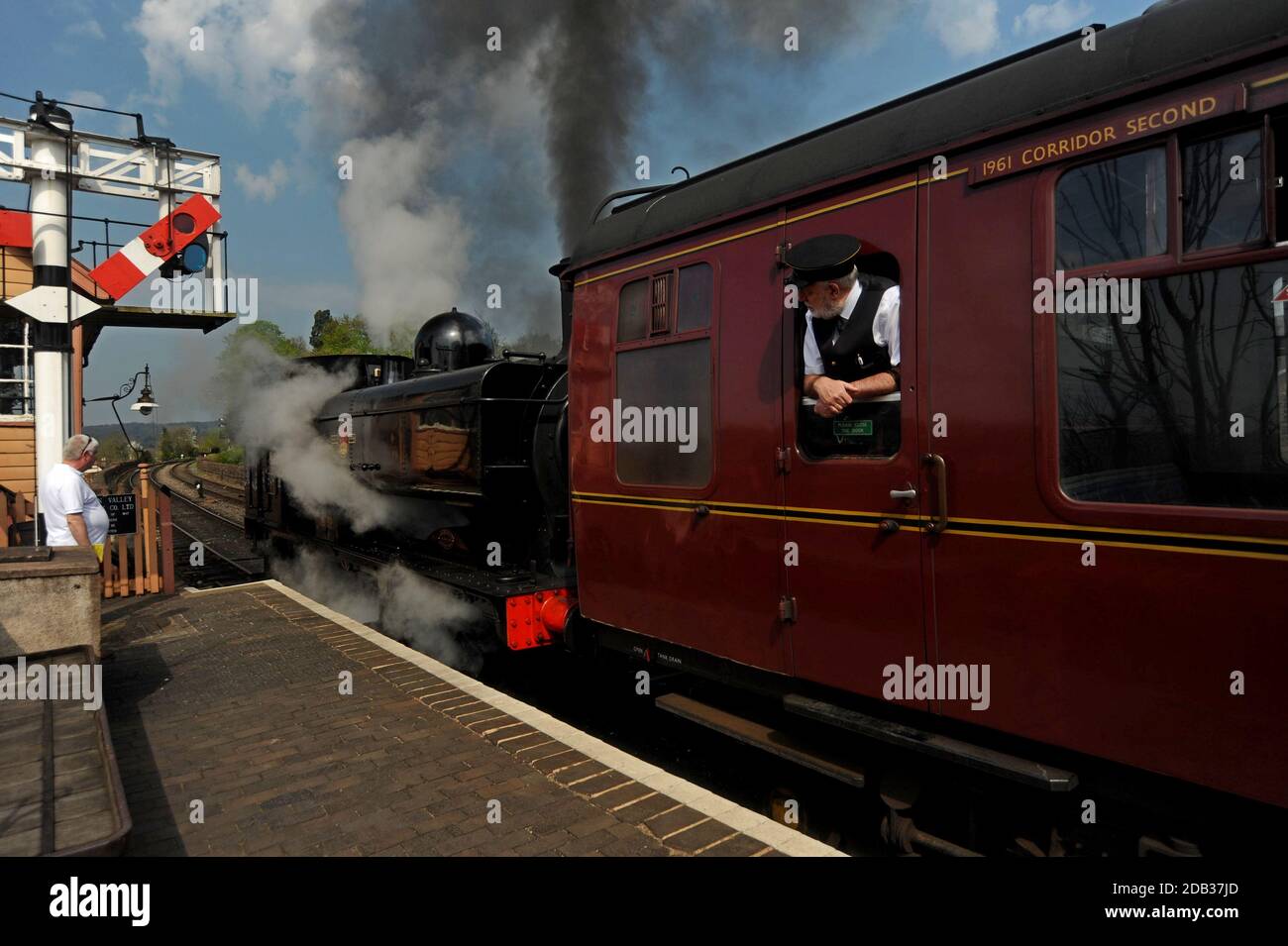 Train Guard watches at GWR pannier tank steam loco 7714 leaves Bewdley ...