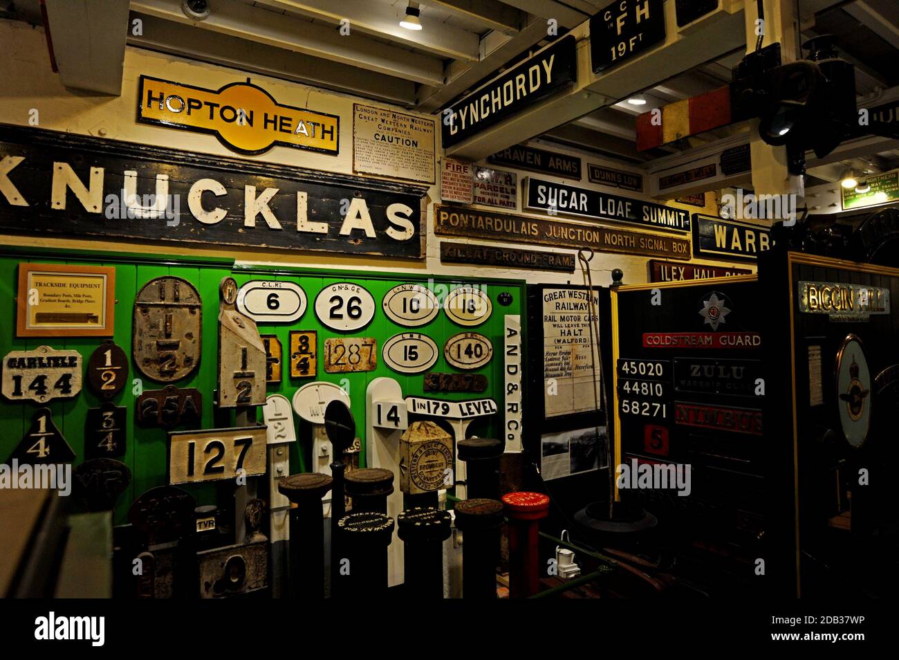 A large display of vintage stationname plates and other railway cast ...