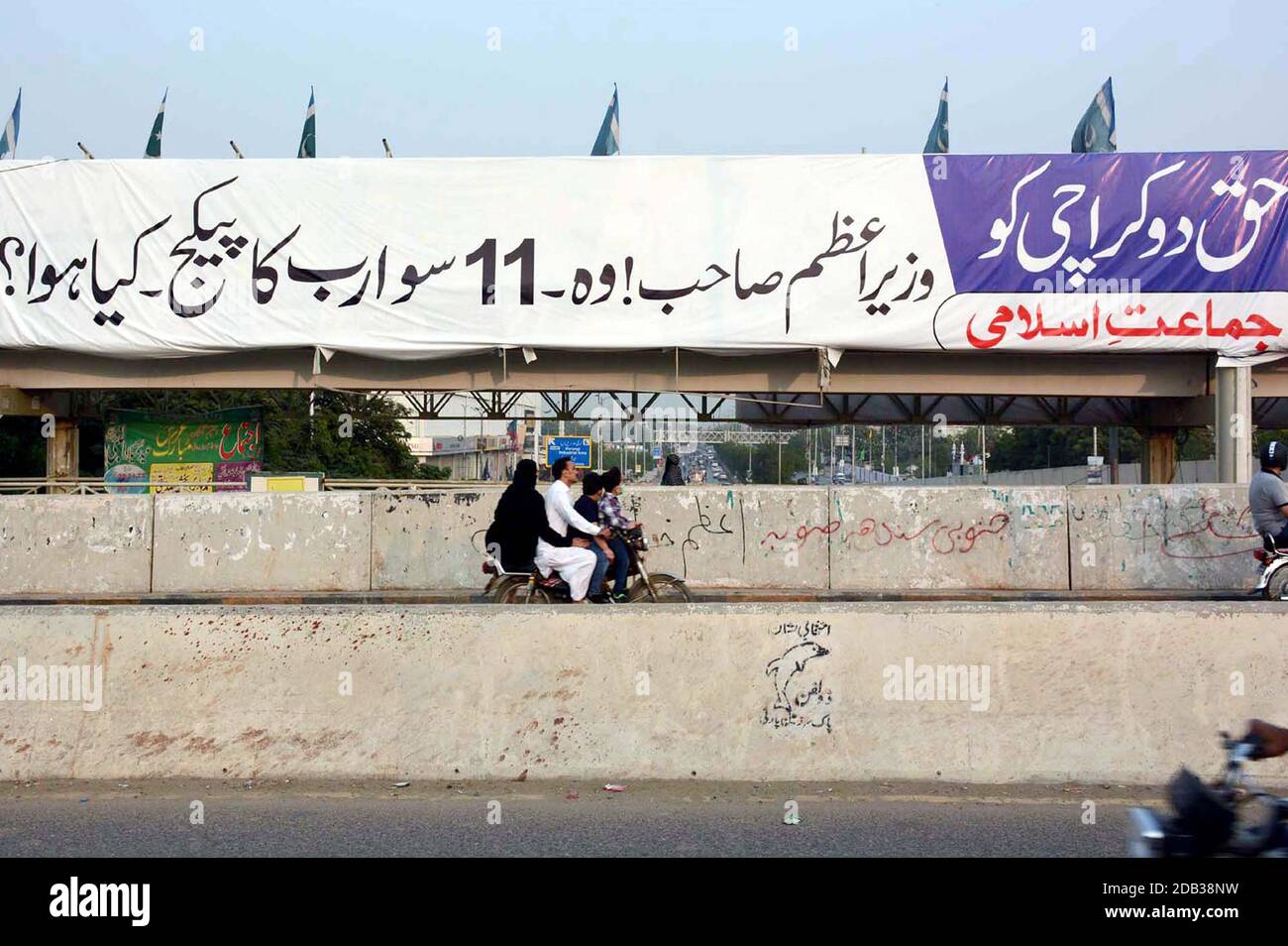 A protest banner against federal and provincial governments hanging by ...