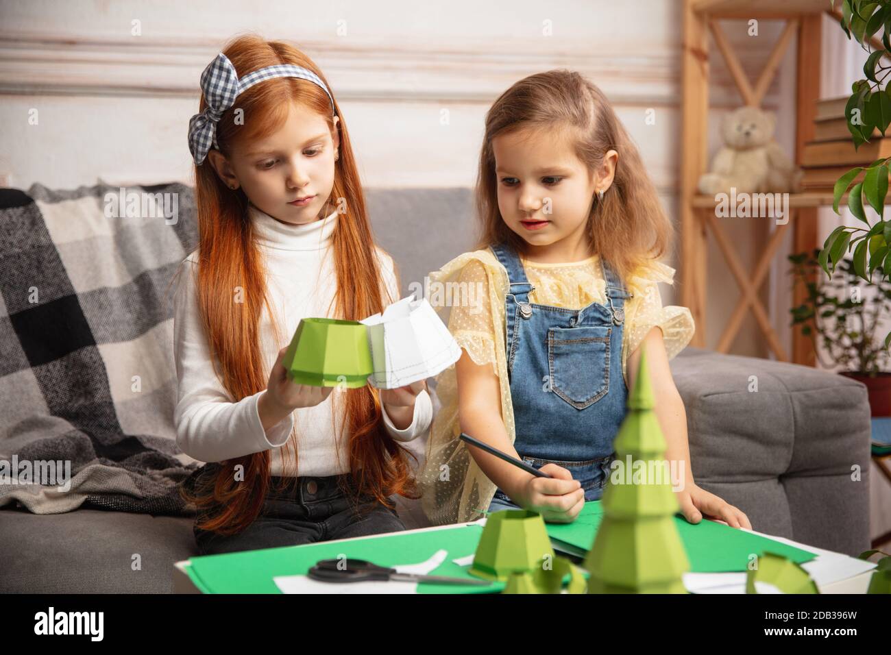 Happiness. Two little children, girls together in creativity of the ...