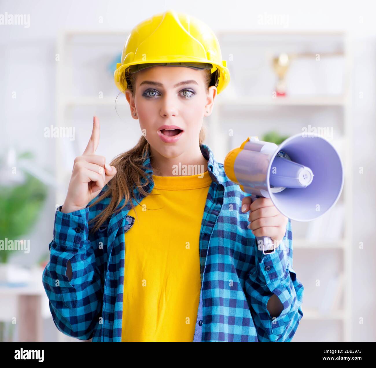 The angry building supervisor with megaphone Stock Photo - Alamy