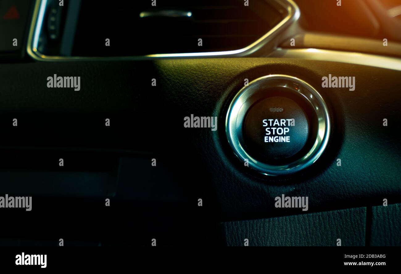 Start stop engine button of luxury car. Push up button for start or ...