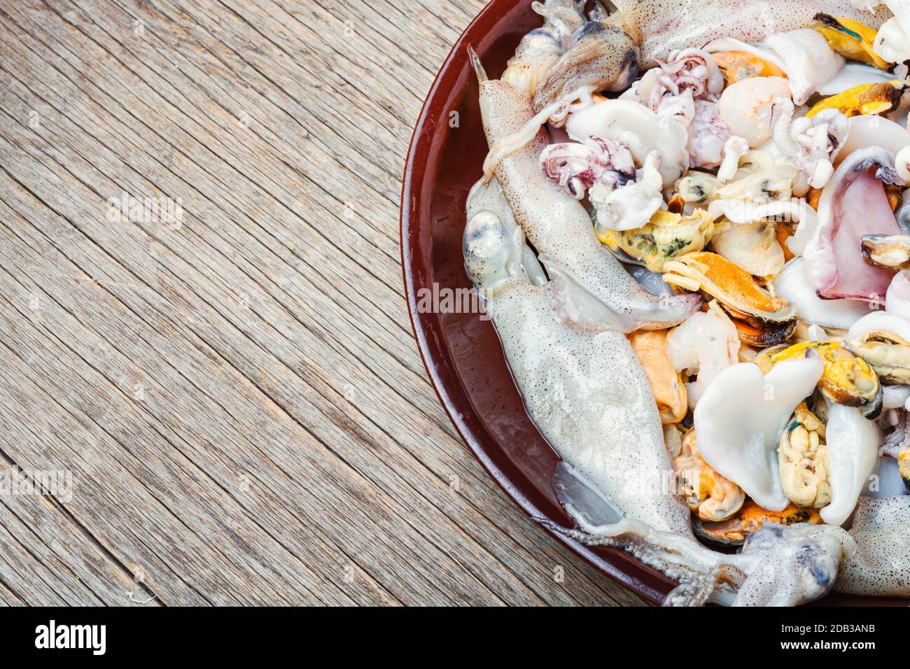 Raw seafood with fresh mussels,clams,squid, shrimps and spice.Healthy ...