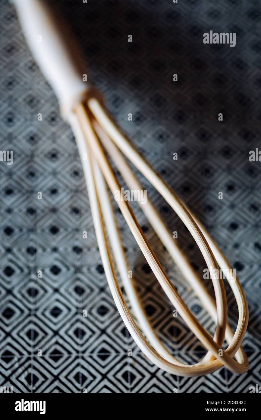 Modern Wooden Whisk on Patterned Background - Cooking Equipment ...