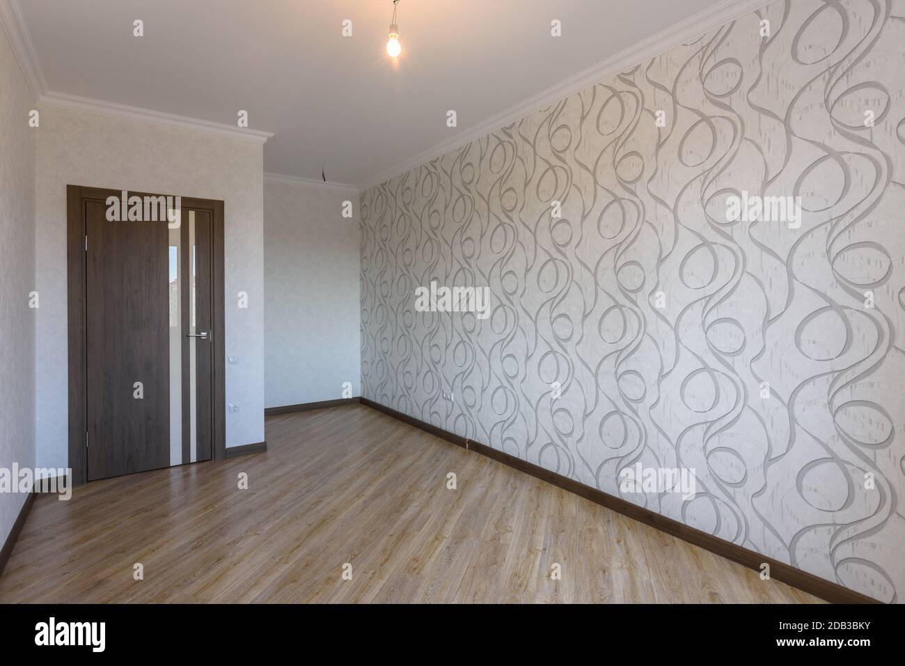The interior of the future room after renovation with wallpaper on the ...