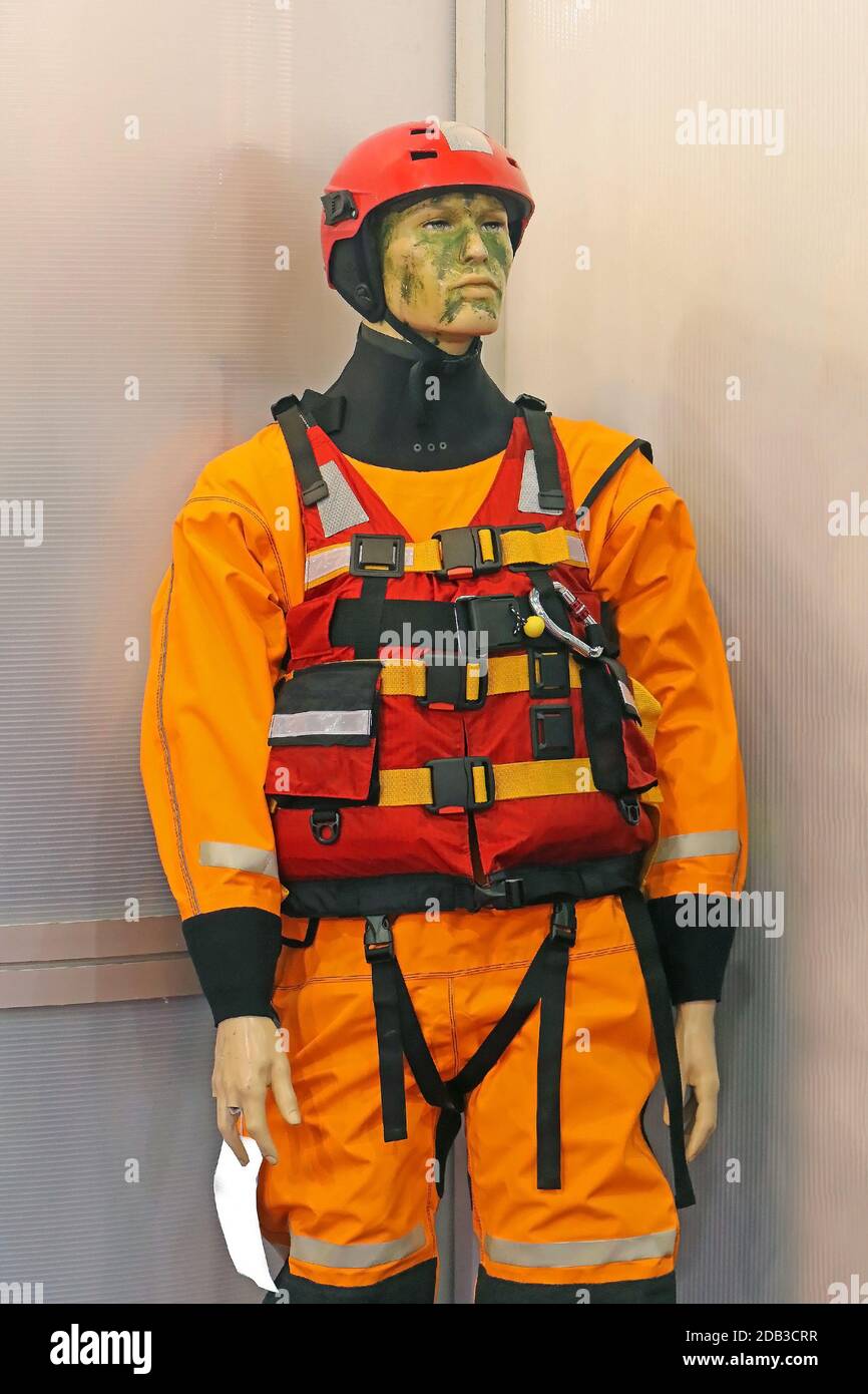 Security climbing gear suit jacket west and helmet on mannequin Stock ...