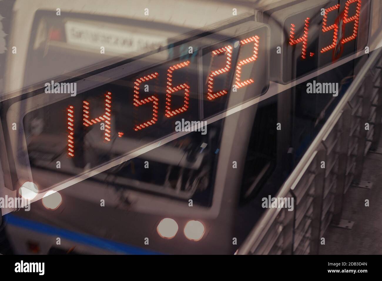 Arriving metro train and clock, double exposure Stock Photo - Alamy