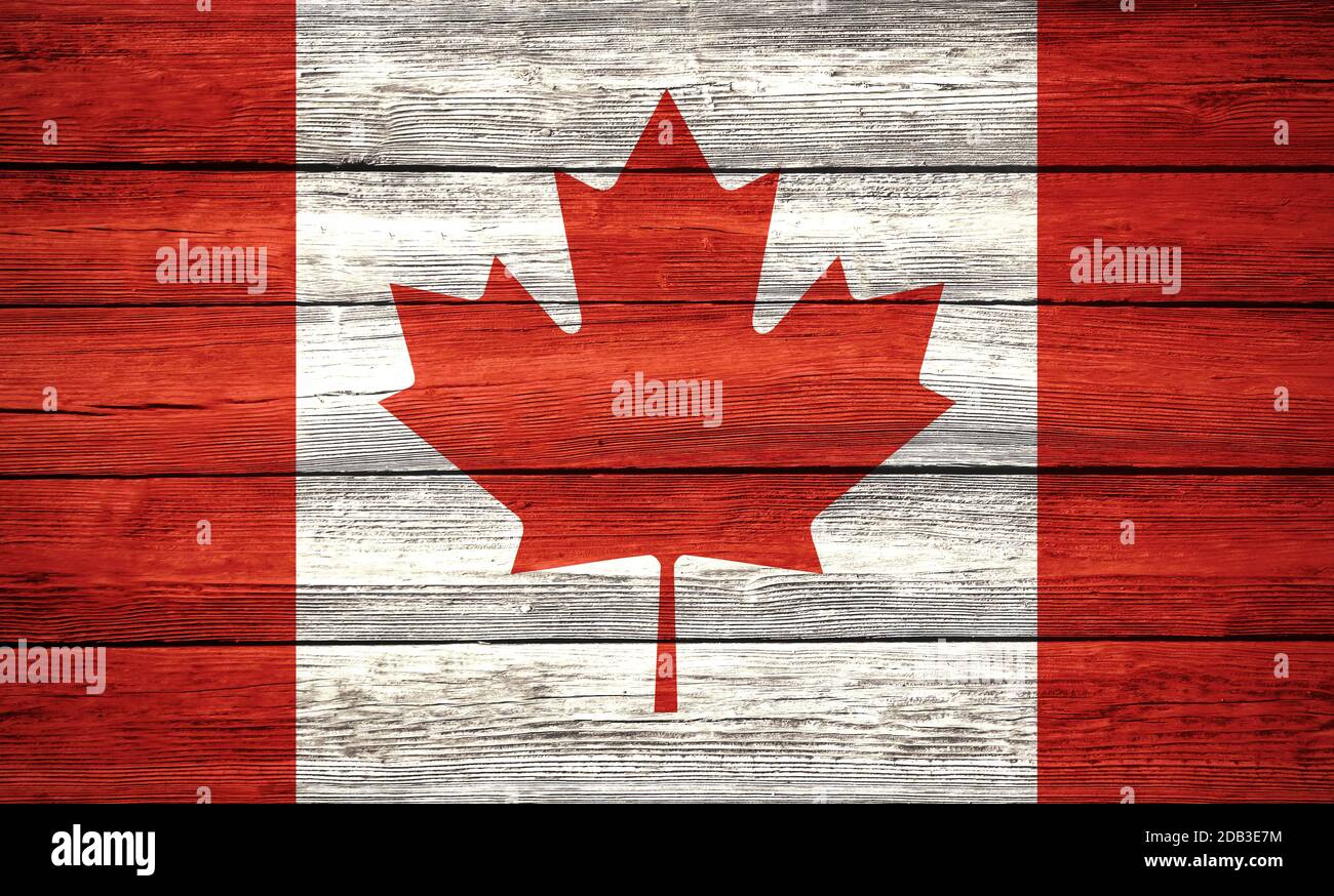 Maple Leaf canadian national flag painted on old wooden plank ...