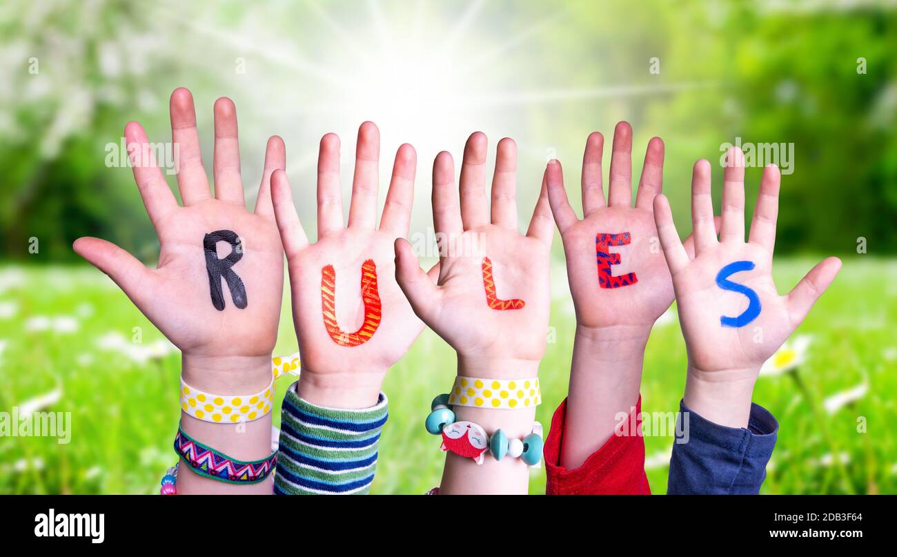Children Hands Building Colorful Word Rules. Green Grass Meadow As ...