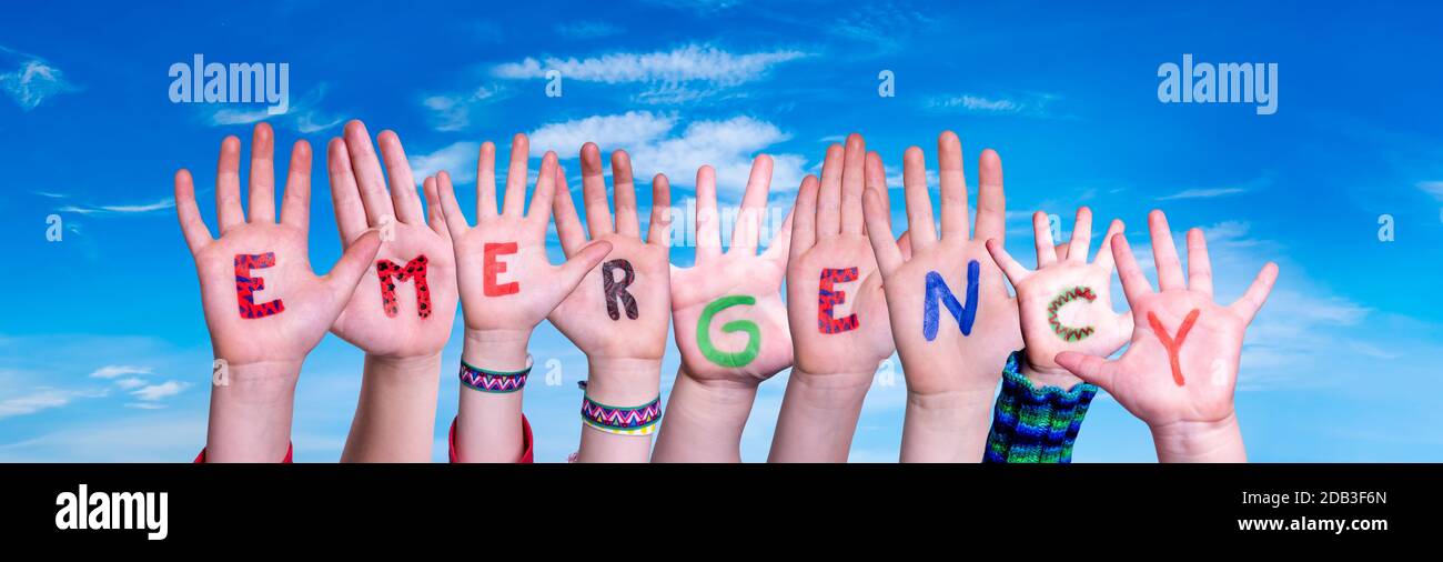 Children Hands Building Colorful Word Emergency. Blue Sky As Background ...