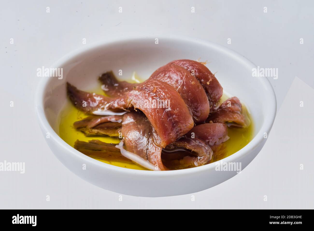 close up salted anchovy fillets isolated Stock Photo - Alamy