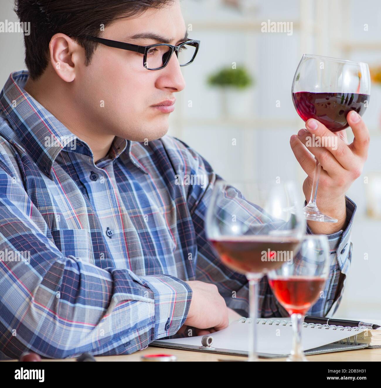 The professional sommelier tasting red wine Stock Photo - Alamy