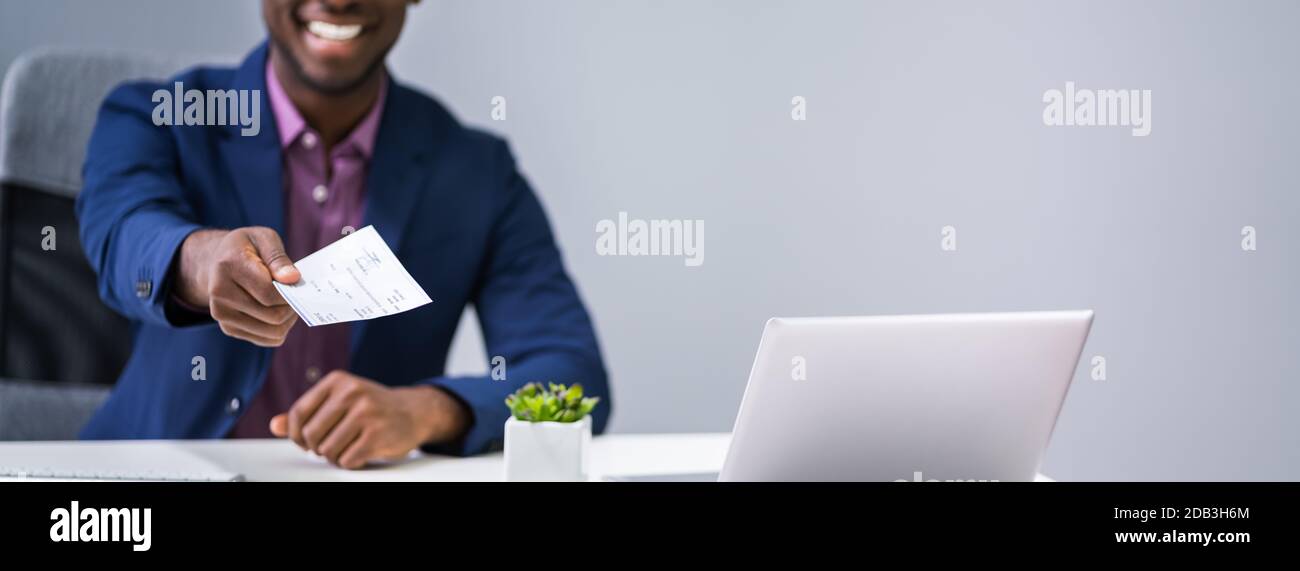 Close-up Photo Of Person's Hand Giving Cheque Stock Photo - Alamy