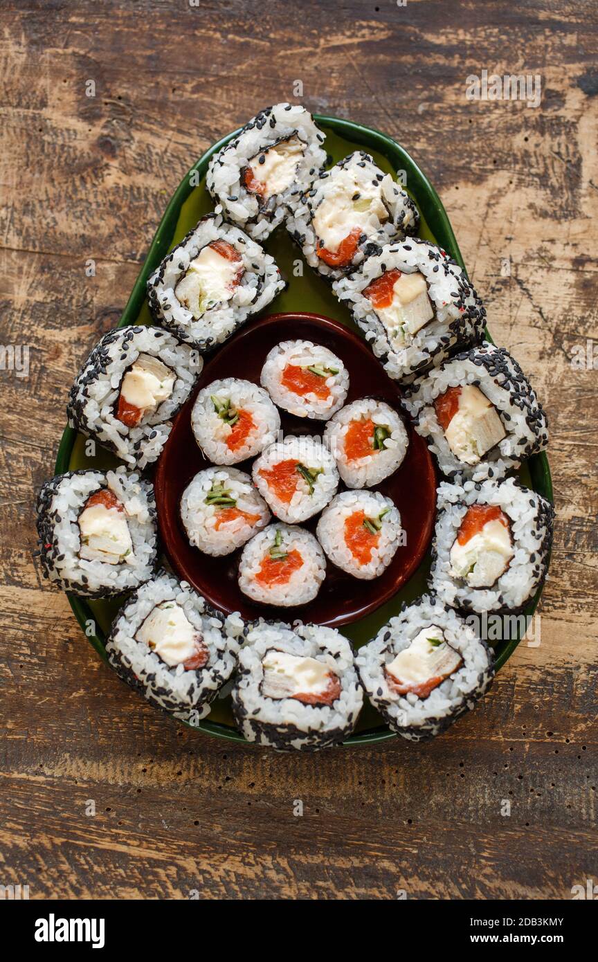 Set of different roles: salmon, eel, cucumber, Philadelphia cheese on ...