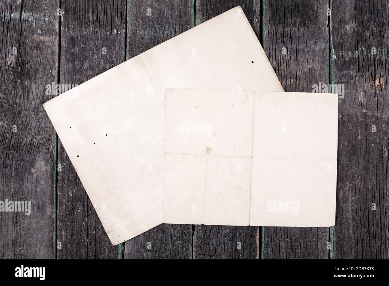 Two sheets of old paper on wooden background, empty templates,mock-up ...