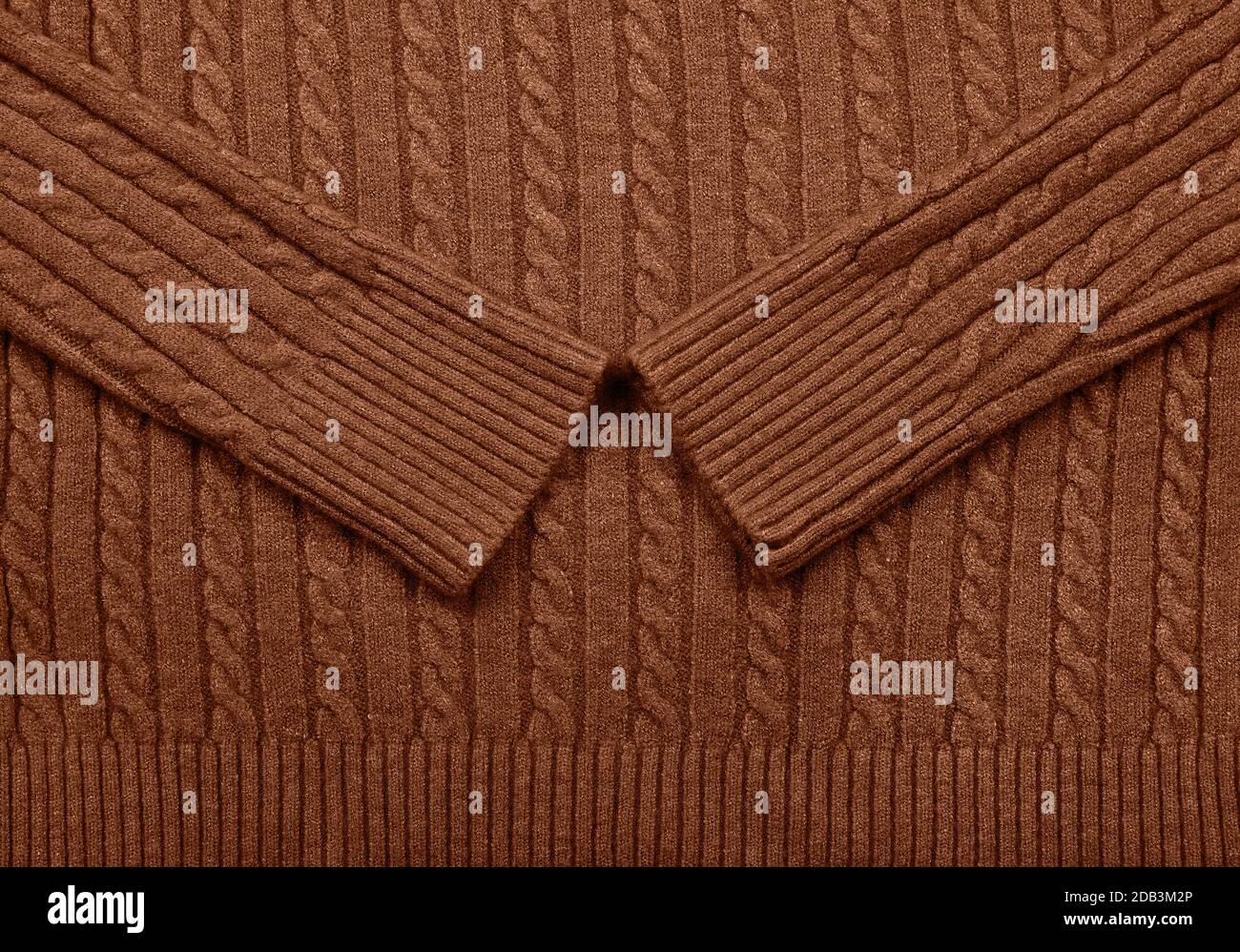 Close up background texture of brown cable knitted wool jersey fabric ...