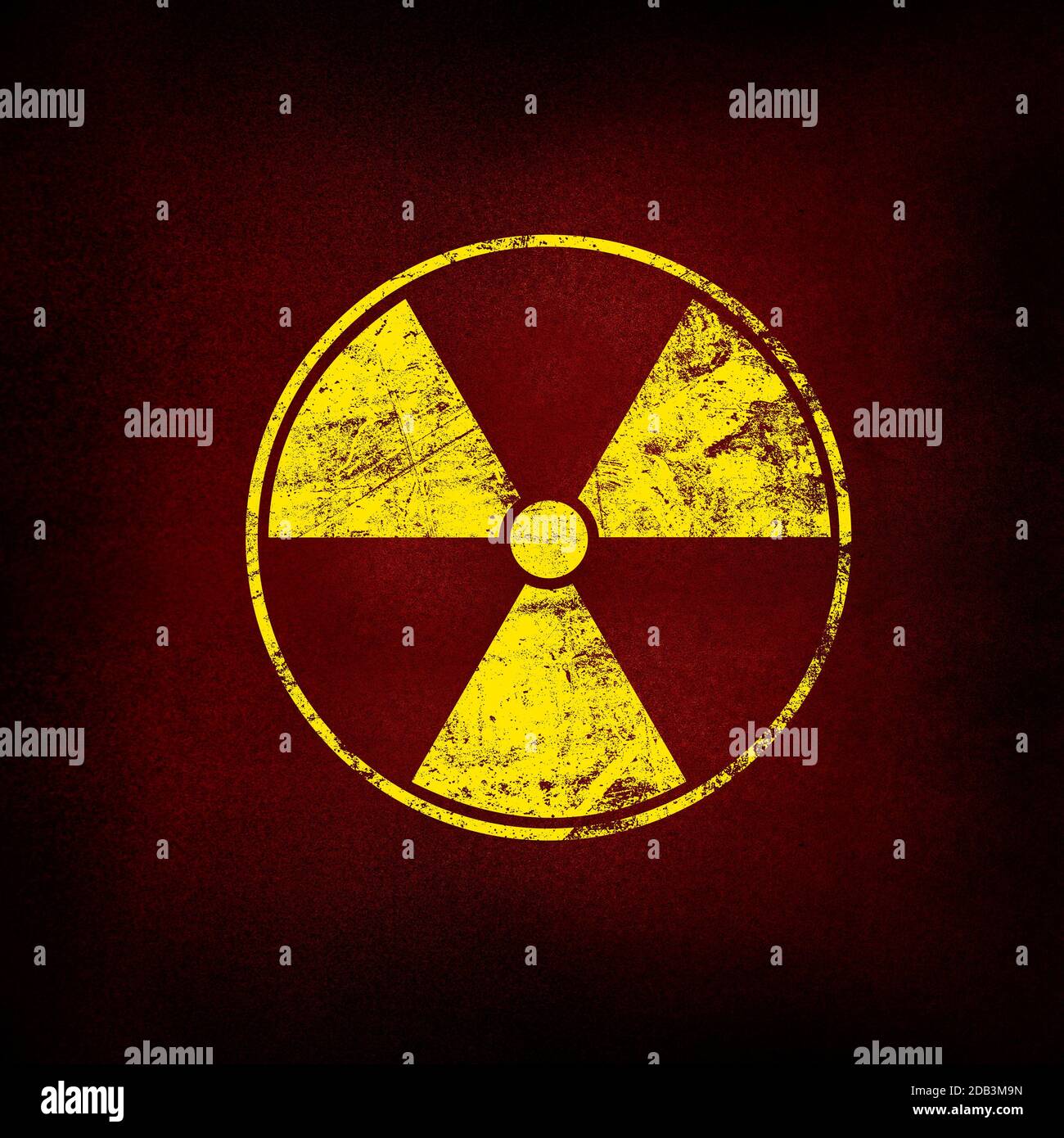 Yellow radioactive hazard warning sign painted over grunge brown and ...