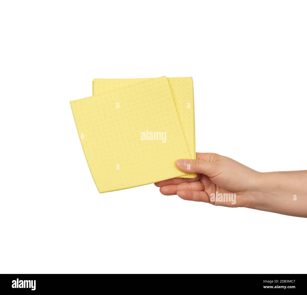 hand holds a yellow rag sponge for cleaning, part of the body is ...